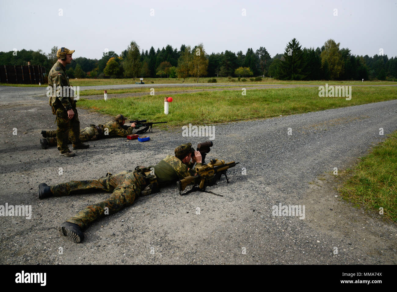 A German sniper team engages targets during the European Best Sniper ...