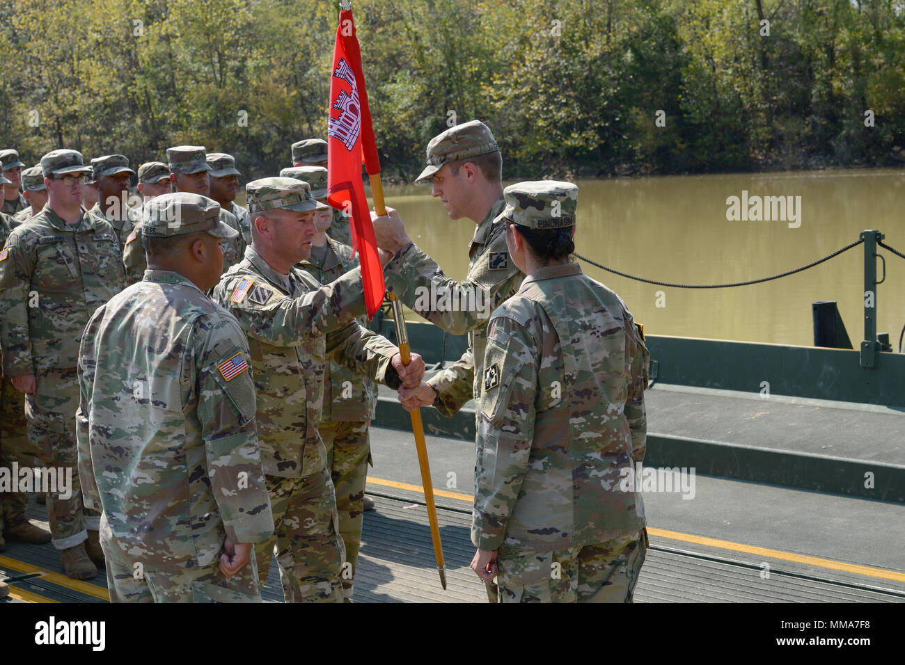 Outgoing Commander CPT Lawrence Griffith takes the guidon during the ...