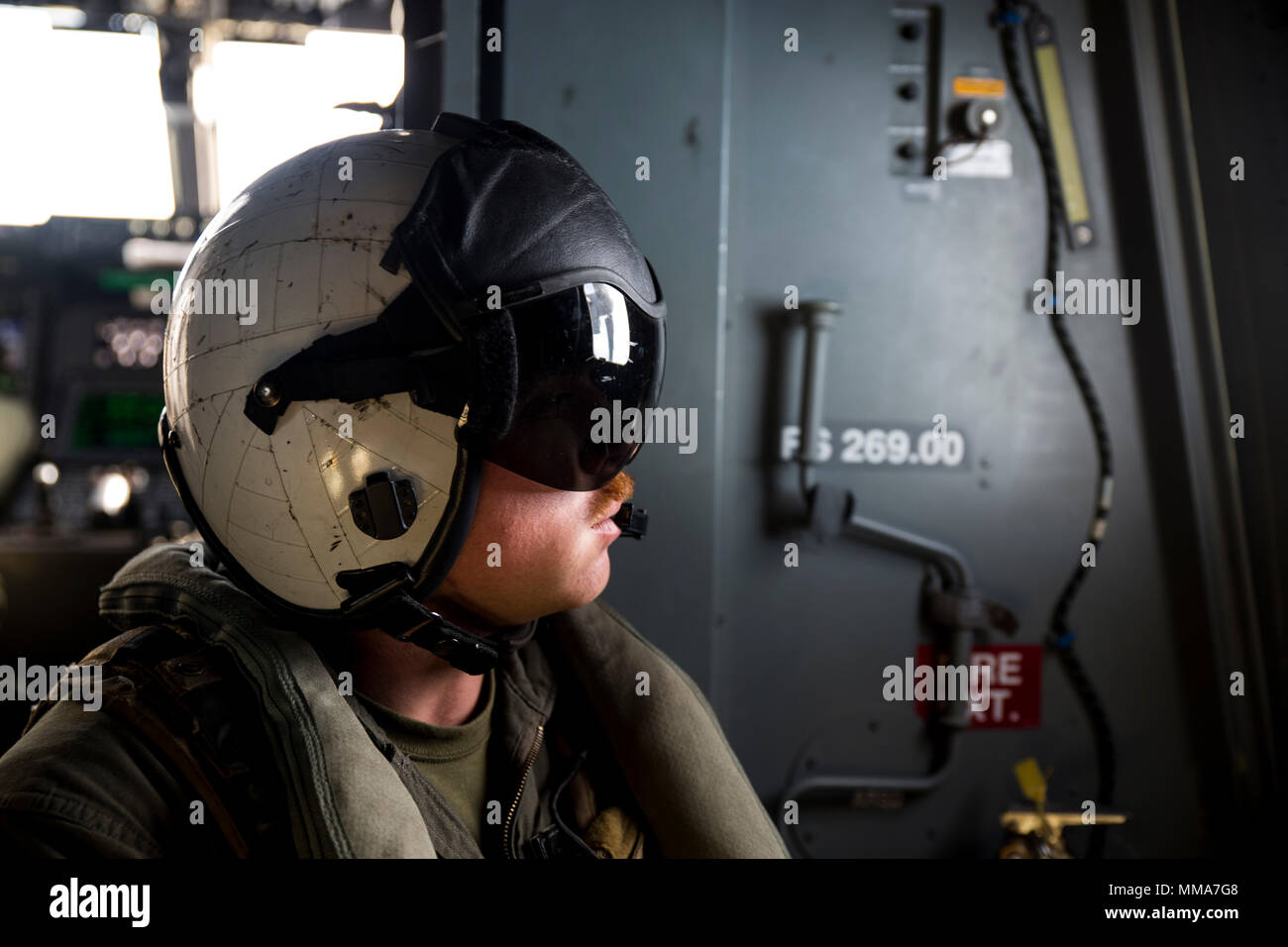 A U.S. Marine Corps crew chief assigned to Special Purpose Marine Air ...