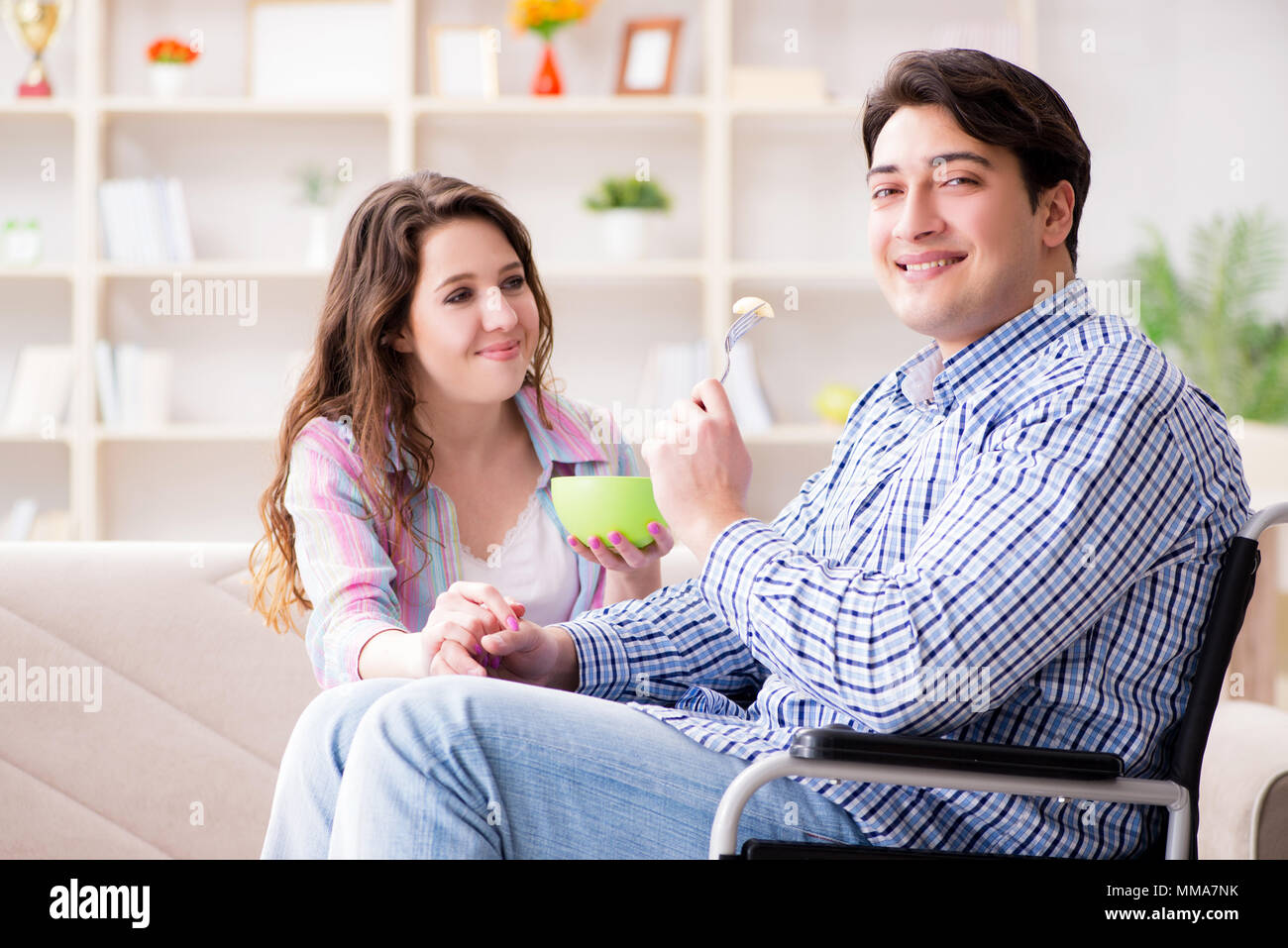 Young family taking care of each other Stock Photo - Alamy