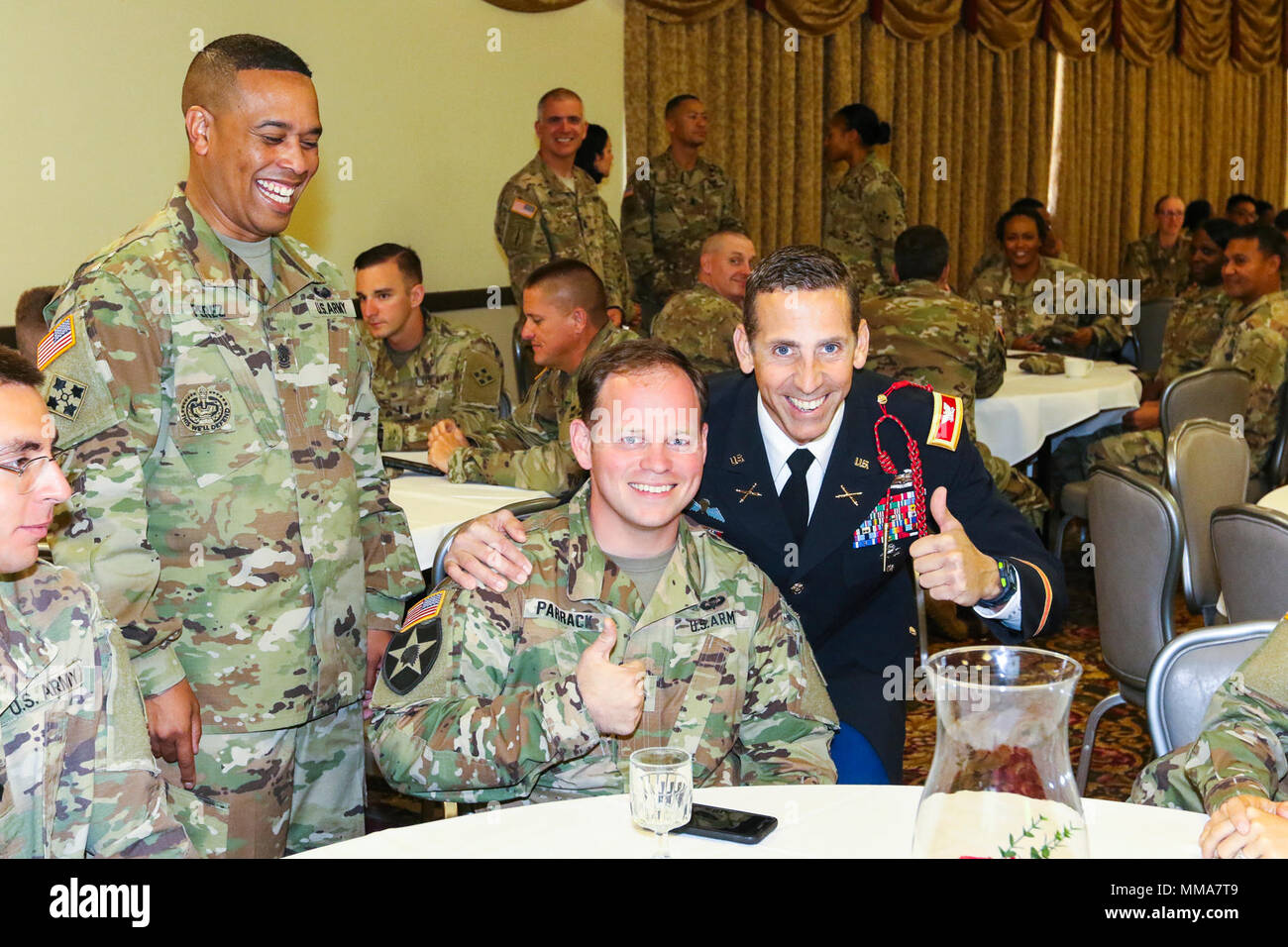 Col. Norberto Menendez (right), commander of 4th Infantry Division Artillery and guest speaker ...