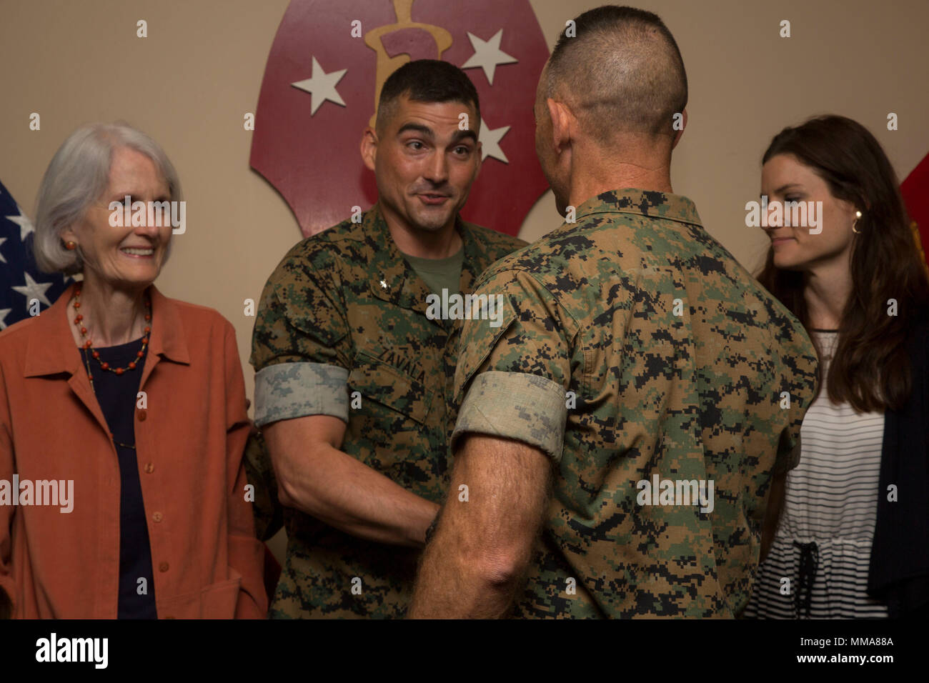 U.S. Marine Corps Lt. Col. Francisco X. Zavala shakes hands with Maj ...