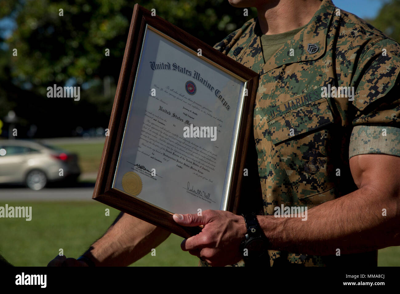 U.S. Marine Corps Staff Sgt. Jeramey D. Mielke is given his promotion ...