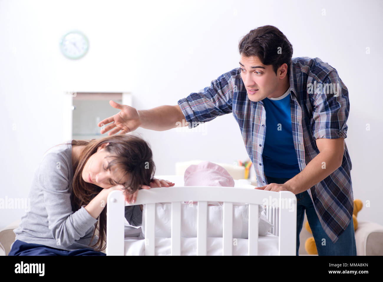 Young dad cannot stand baby crying Stock Photo - Alamy