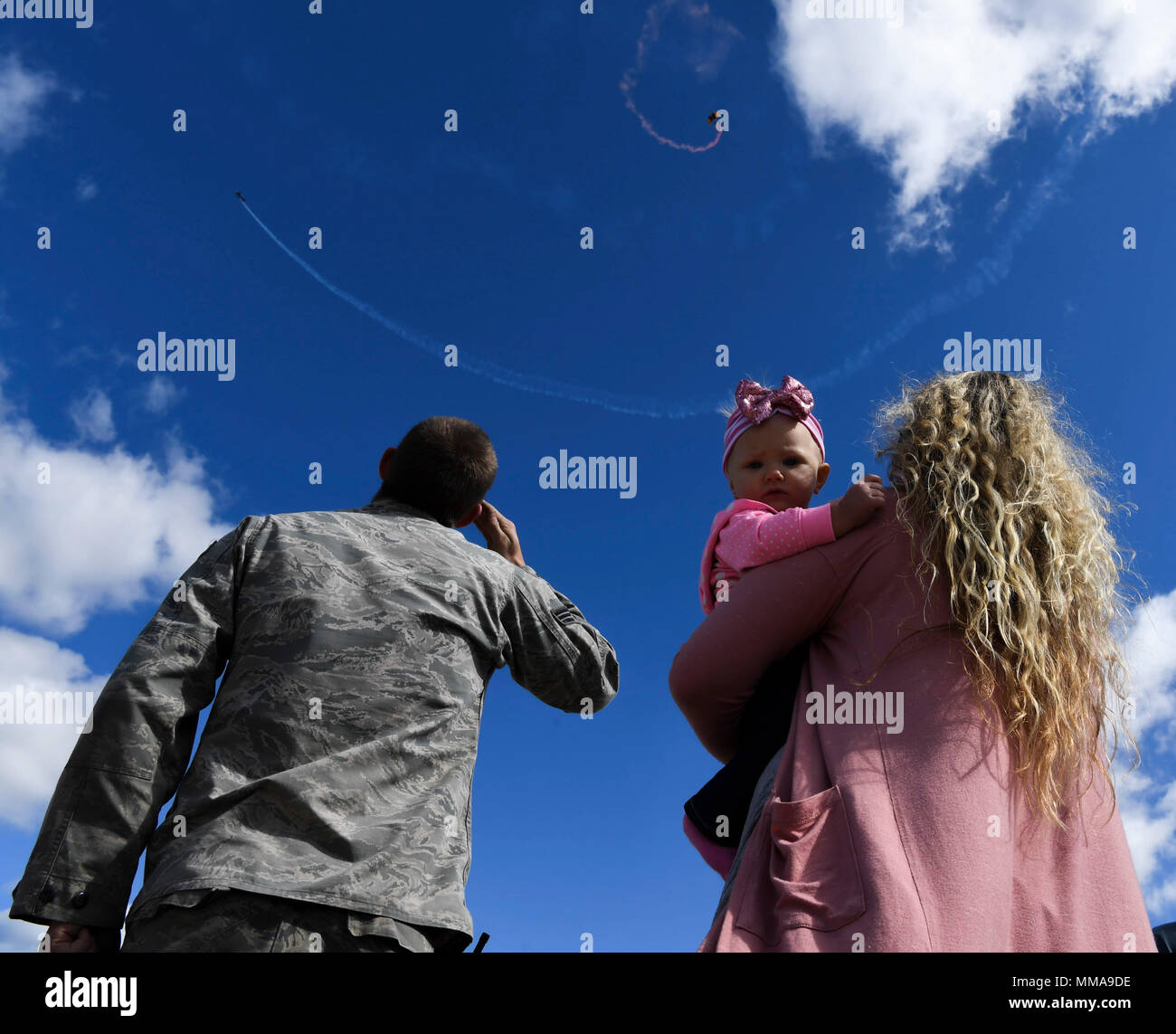 U.S. Senior Airman Brandon Caldwell and wife Molly, holding their ...