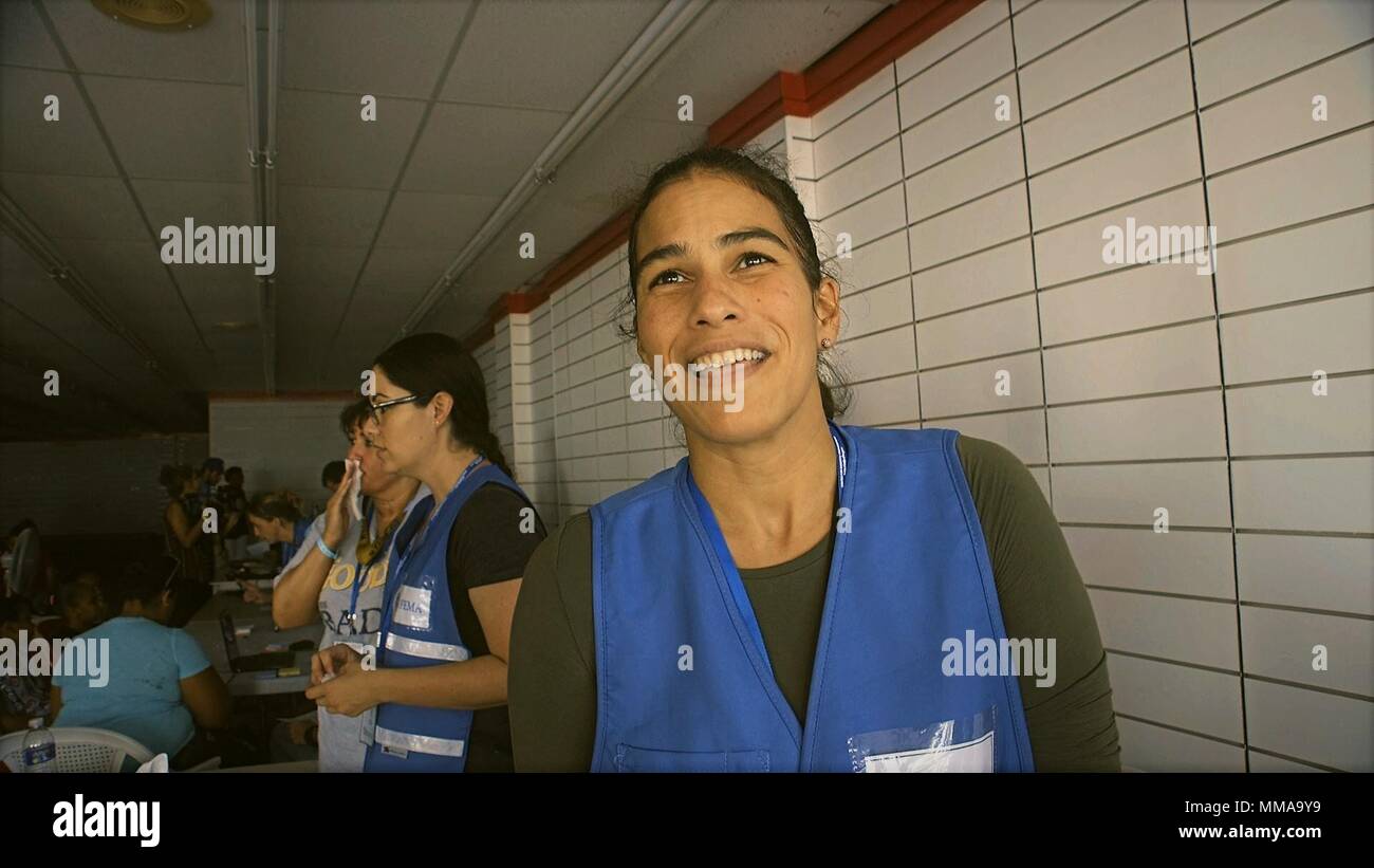 A Federal Emergency Management Agency employee gives an interview for ...