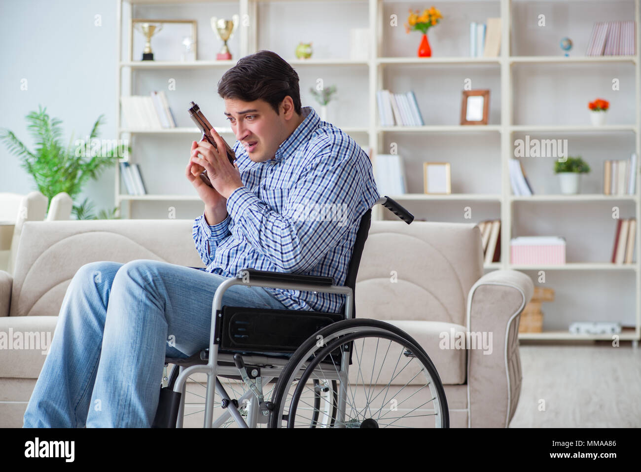 Disabled student desperate and committing suicide Stock Photo - Alamy