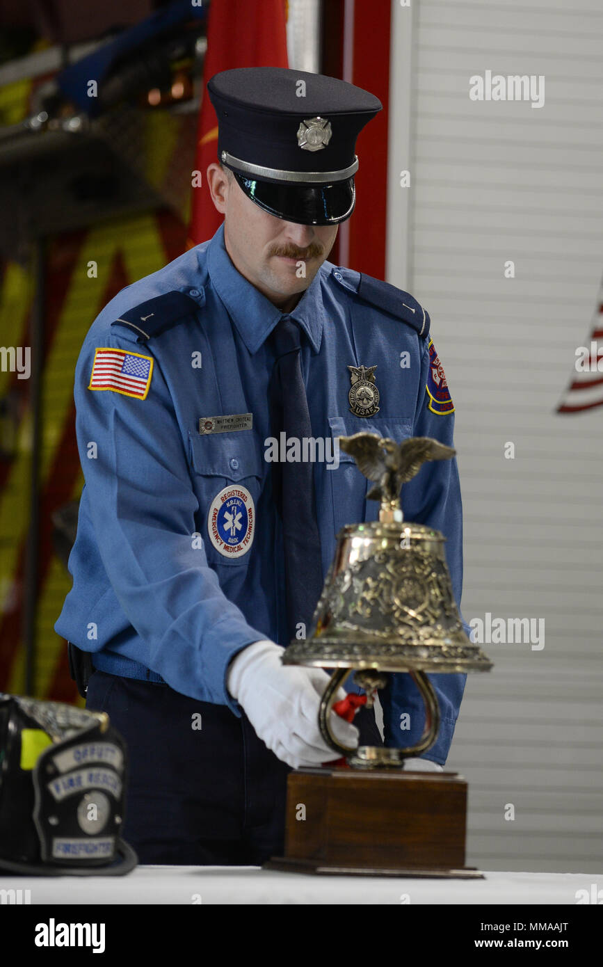 Matthew Croteau, Offutt firefighter, rings a bell twenty times during a ...