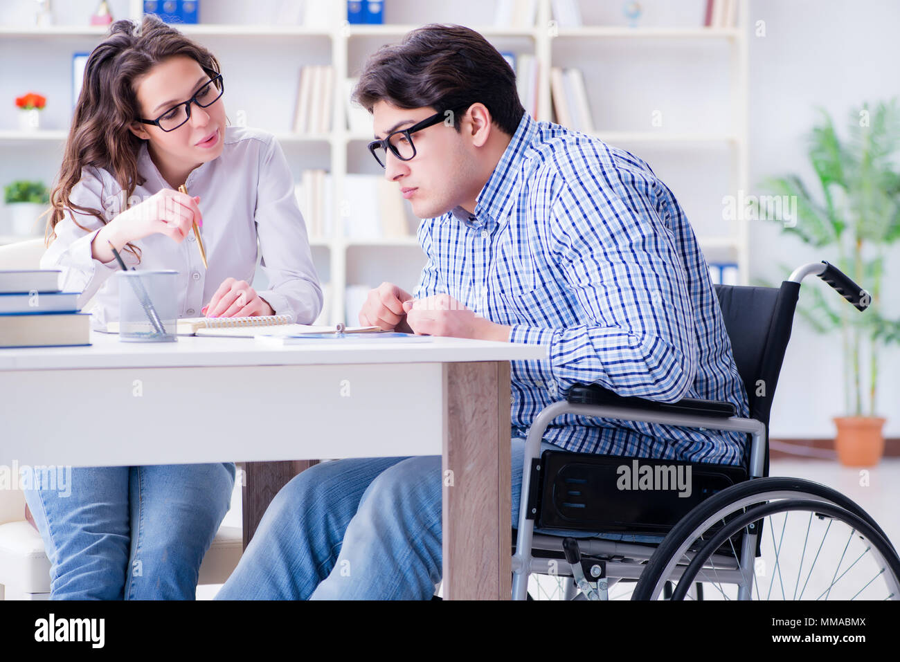 Disabled student studying and preparing for college exams Stock Photo ...