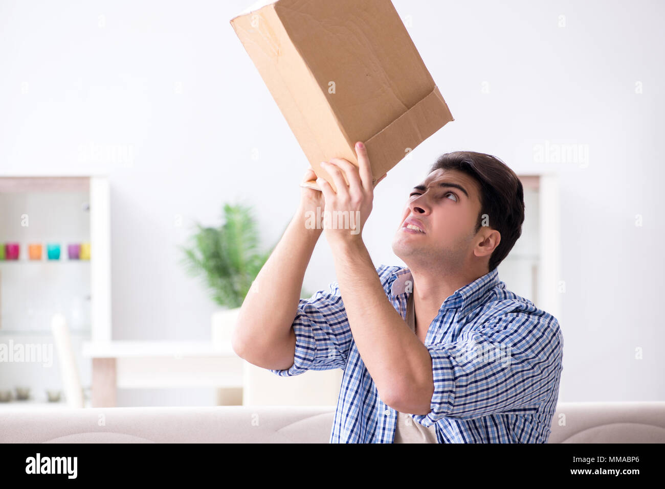 Man receiving empty parcel with stolen goods Stock Photo - Alamy