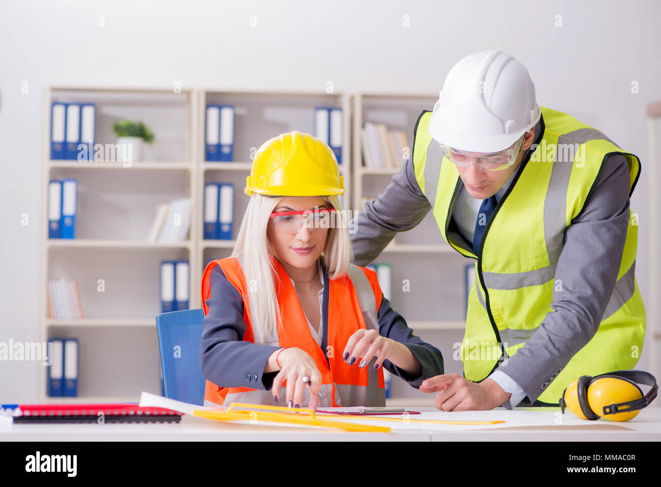 Construction workers checking drawing hi-res stock photography and ...