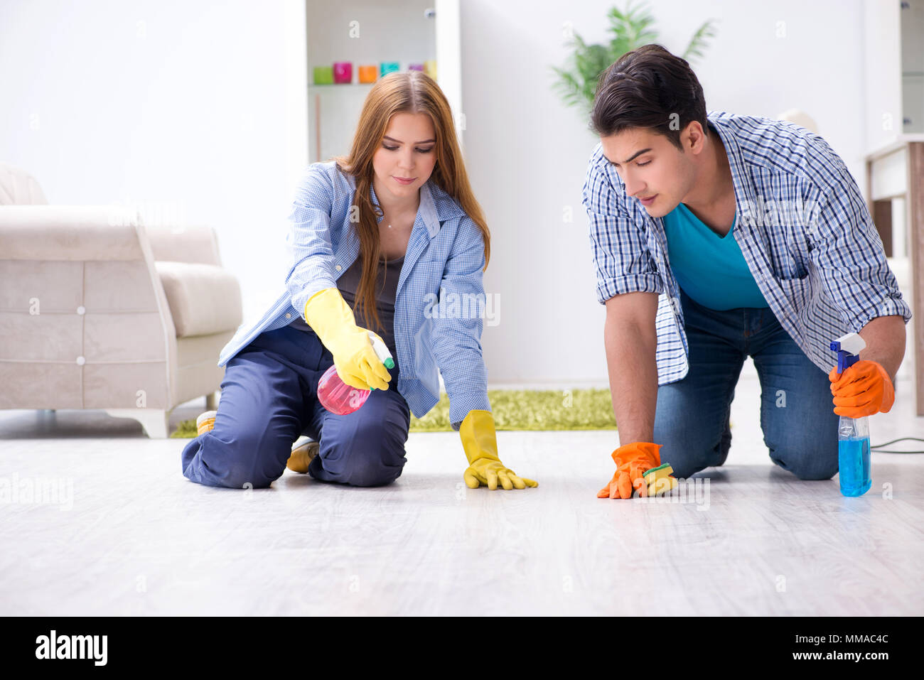 Young family cleaning the house Stock Photo - Alamy