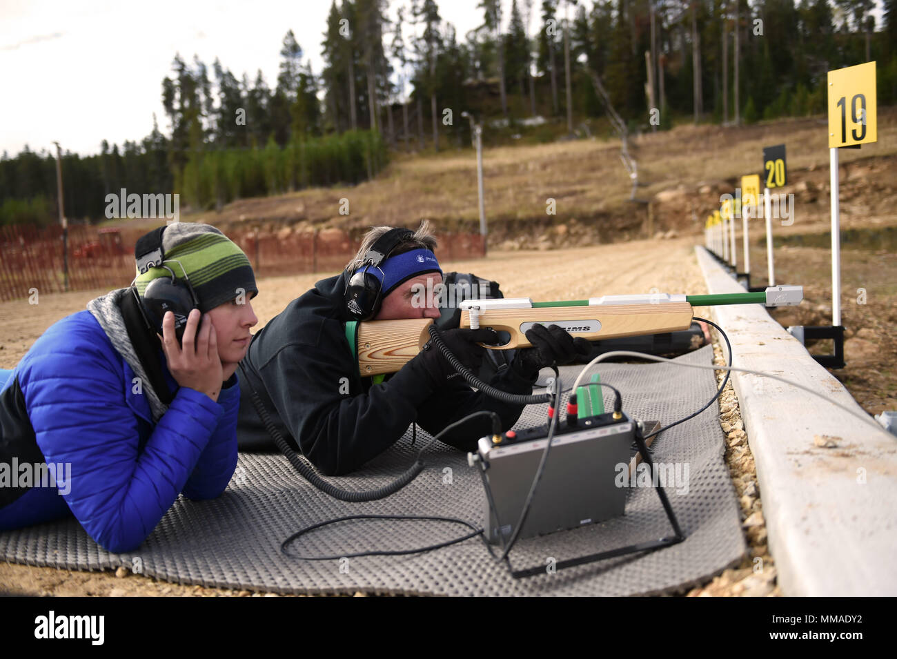 David Collins, a blind Army veteran from Corona, Calif., takes aim with ...