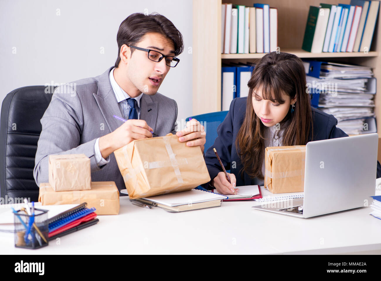 Business people receiving new mail and parcels Stock Photo - Alamy