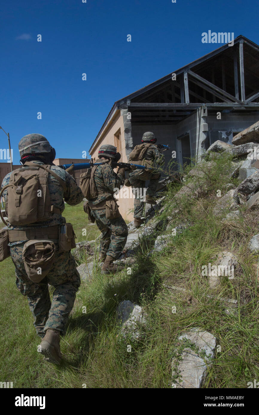 Marines with 2nd Battalion, 8th Marine Regiment enter a building during a military operation on ...