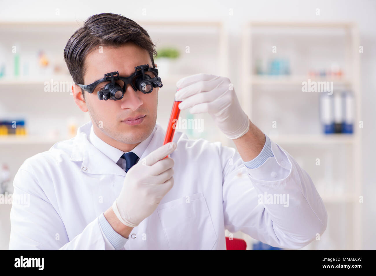 Doctor chemist working on blood samples in lab Stock Photo - Alamy