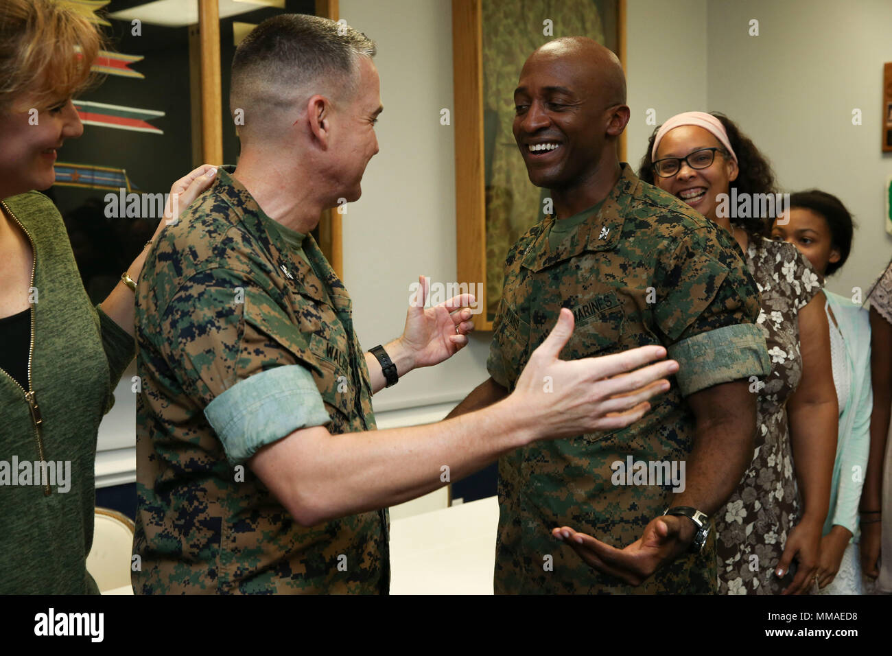 U.S. Marine Corps Col. Jordan Walzer and Col. James Ryan congratulate ...