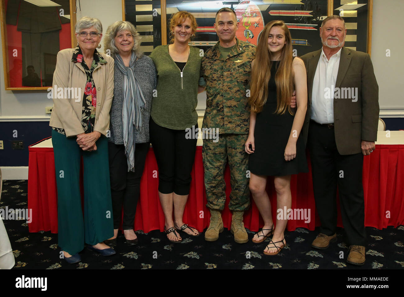 U.S. Marine Corps Col. Jordan Walzer poses with his family following ...