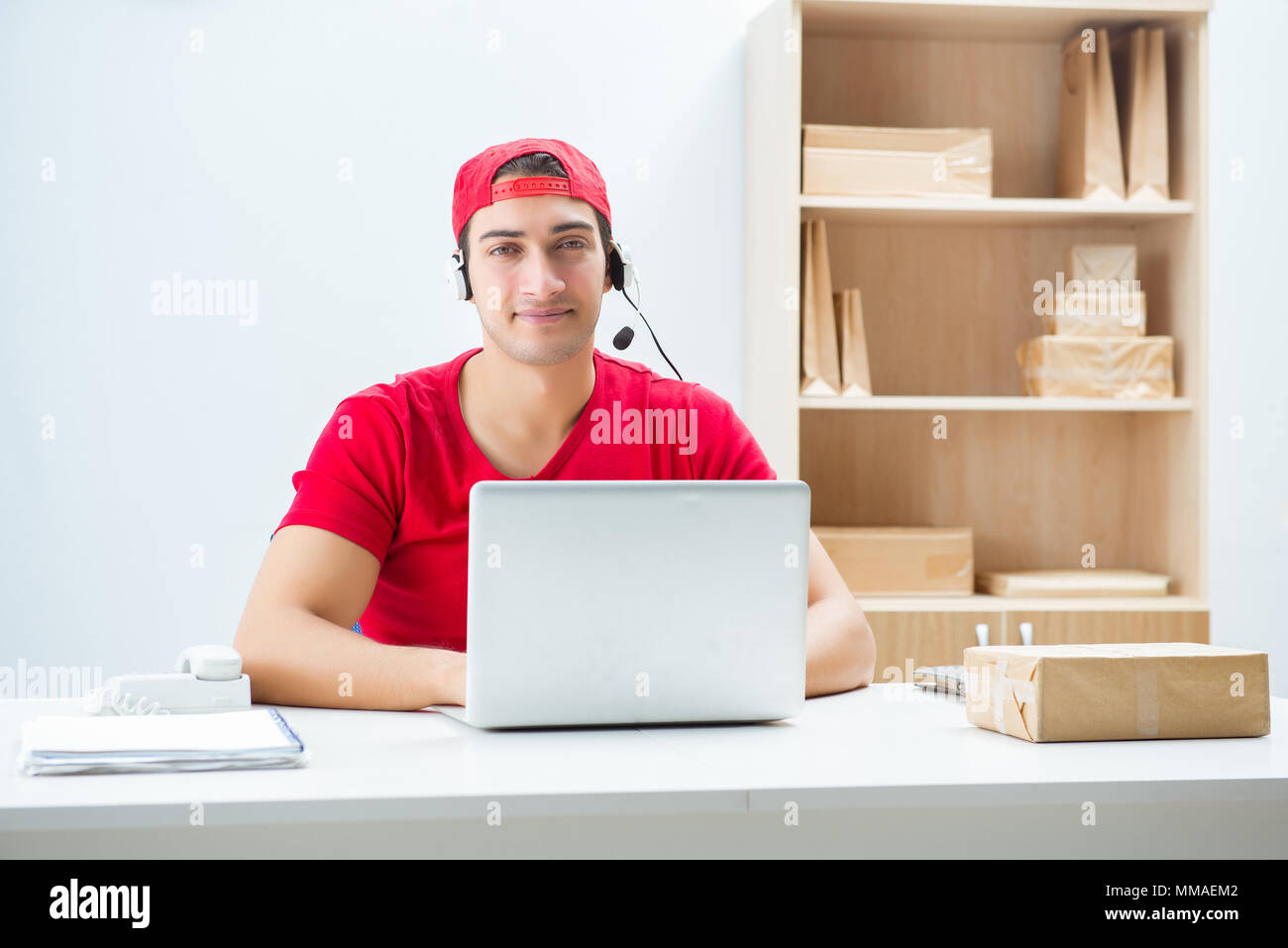 Call center worker at parcel distribution center in post office Stock ...