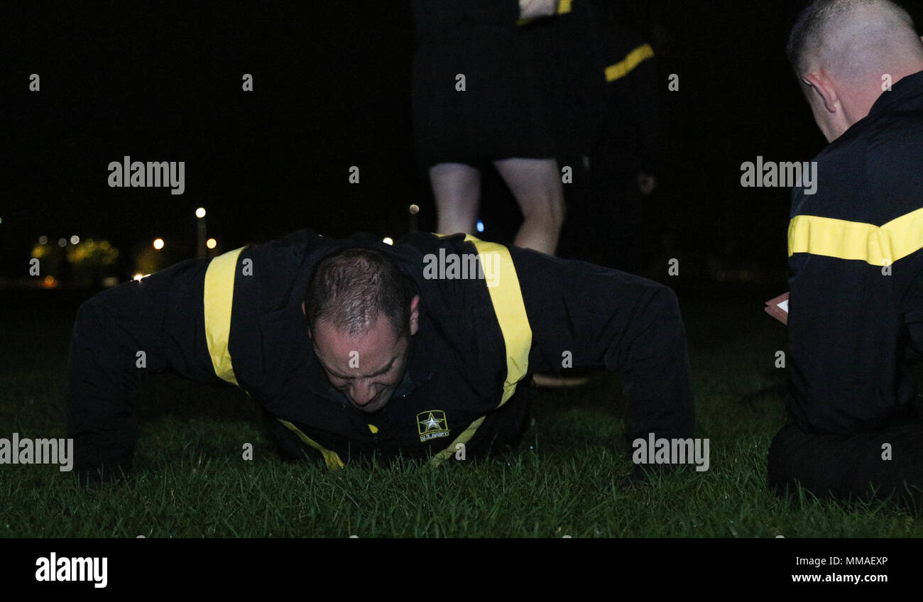 An Iron Horse medic conducts pushups as part of the Army Ranger ...