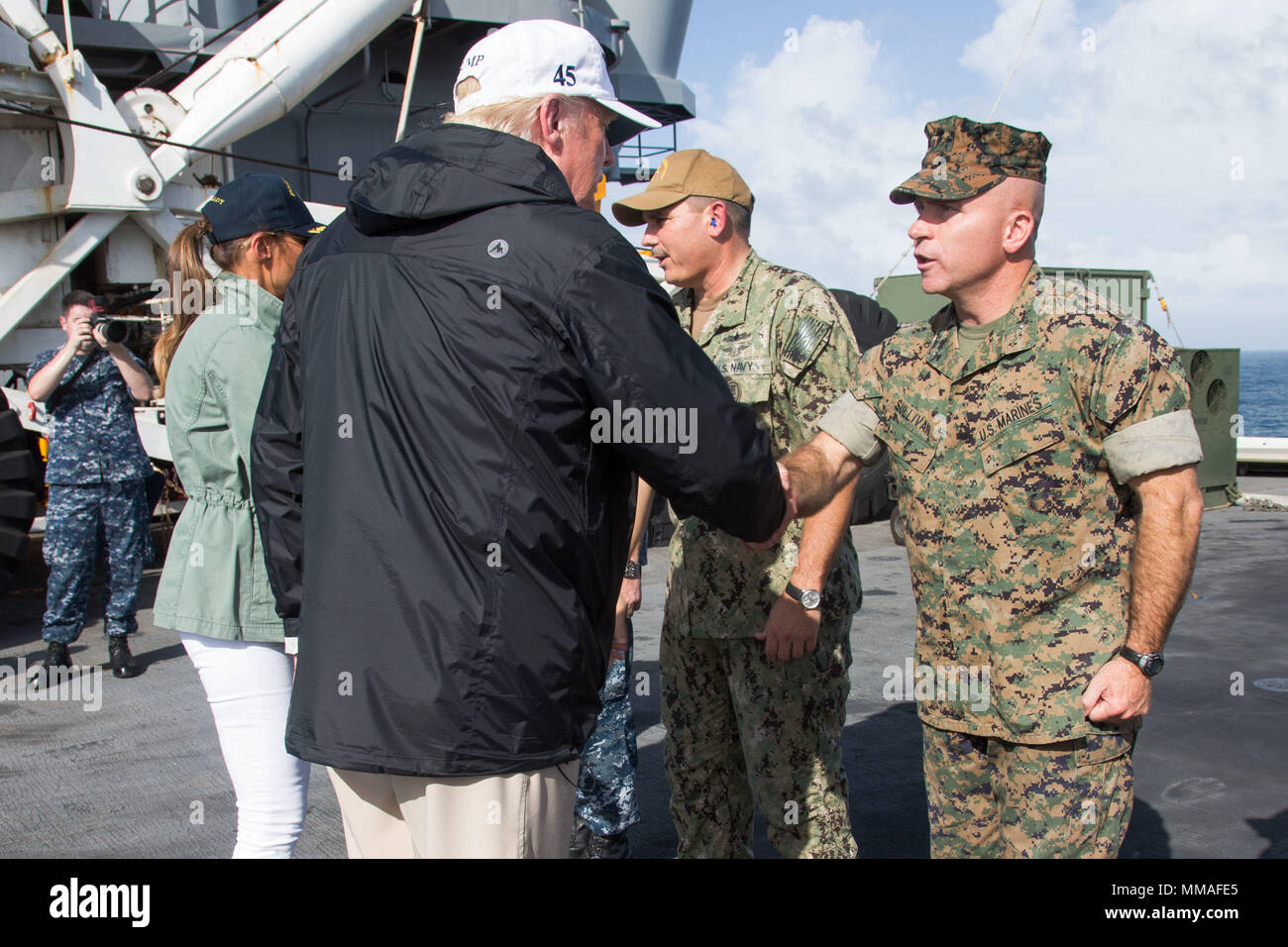 President Donald J. Trump, left, shakes hands with U.S. Marine Corps ...
