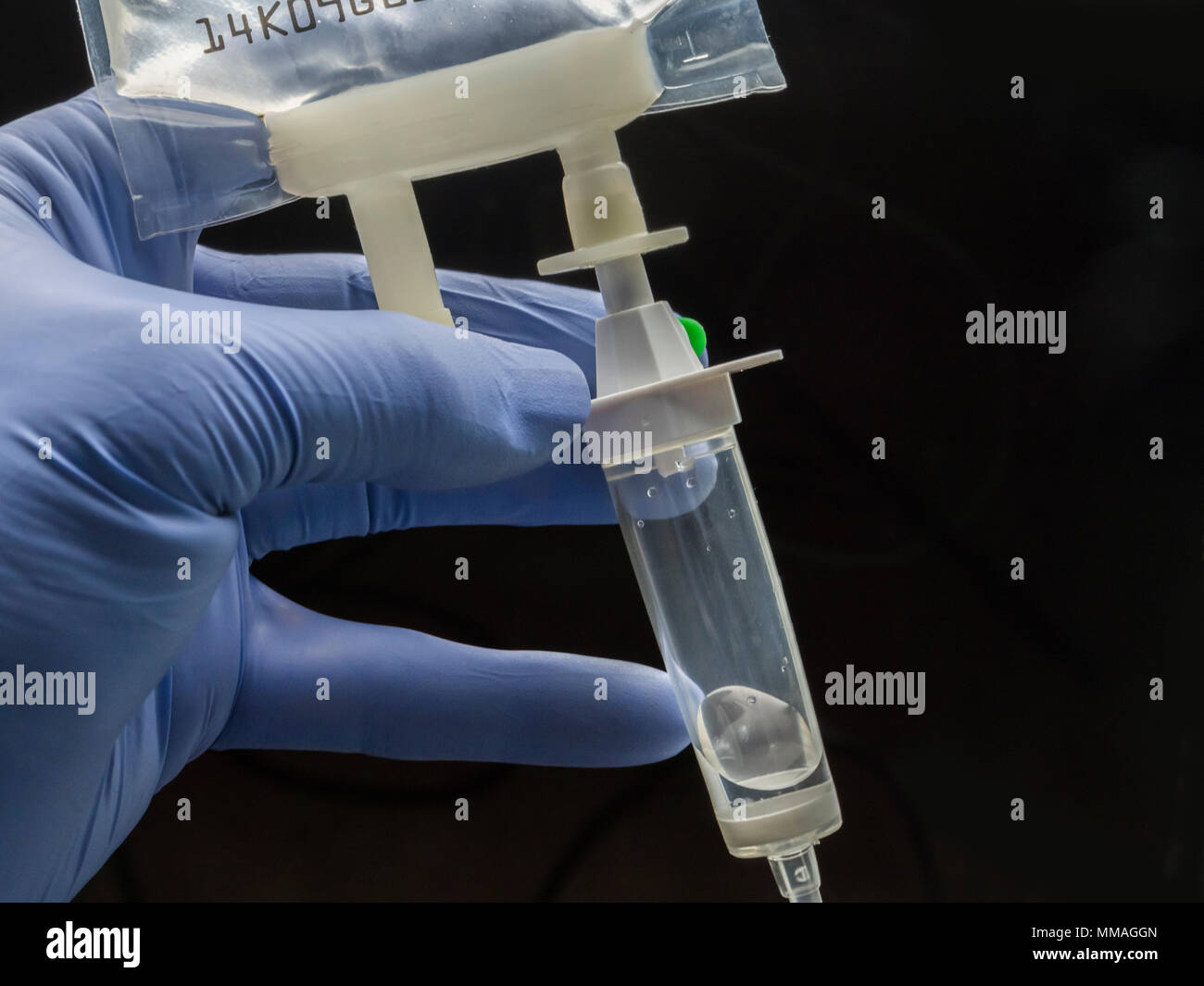Doctor holds drip irrigation system in hospital, conceptual image Stock ...