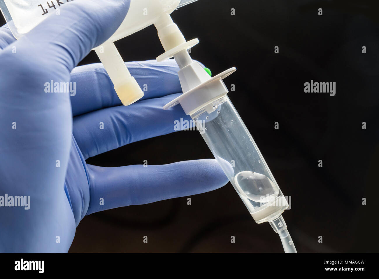 Doctor holds drip irrigation system in hospital, conceptual image Stock ...