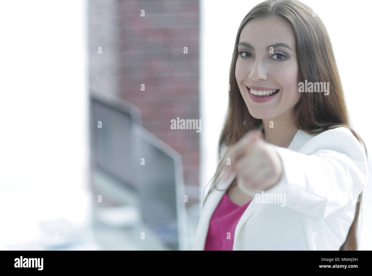 confident business woman pointing finger forward Stock Photo - Alamy