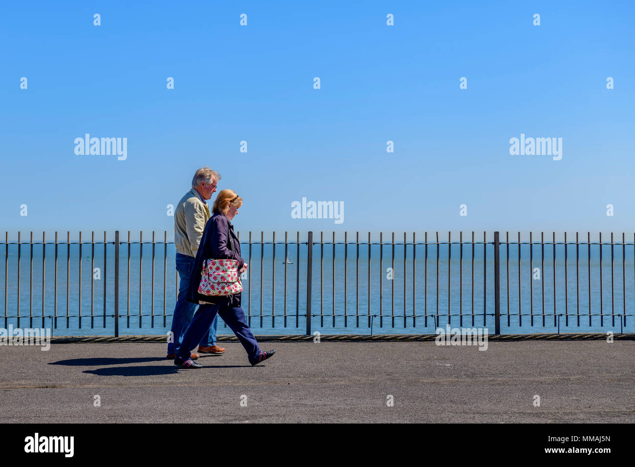 Senior couple walking along the promenade Ramsgate UK Stock Photo - Alamy