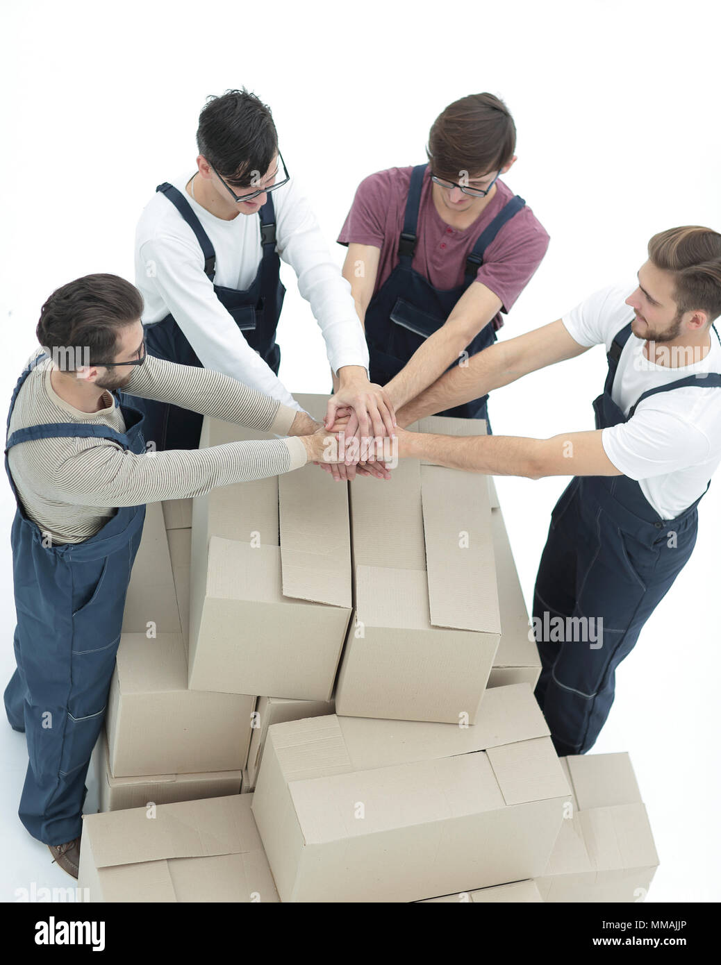 Delivery men carrying stack of boxes. Isolated on white Stock Photo - Alamy