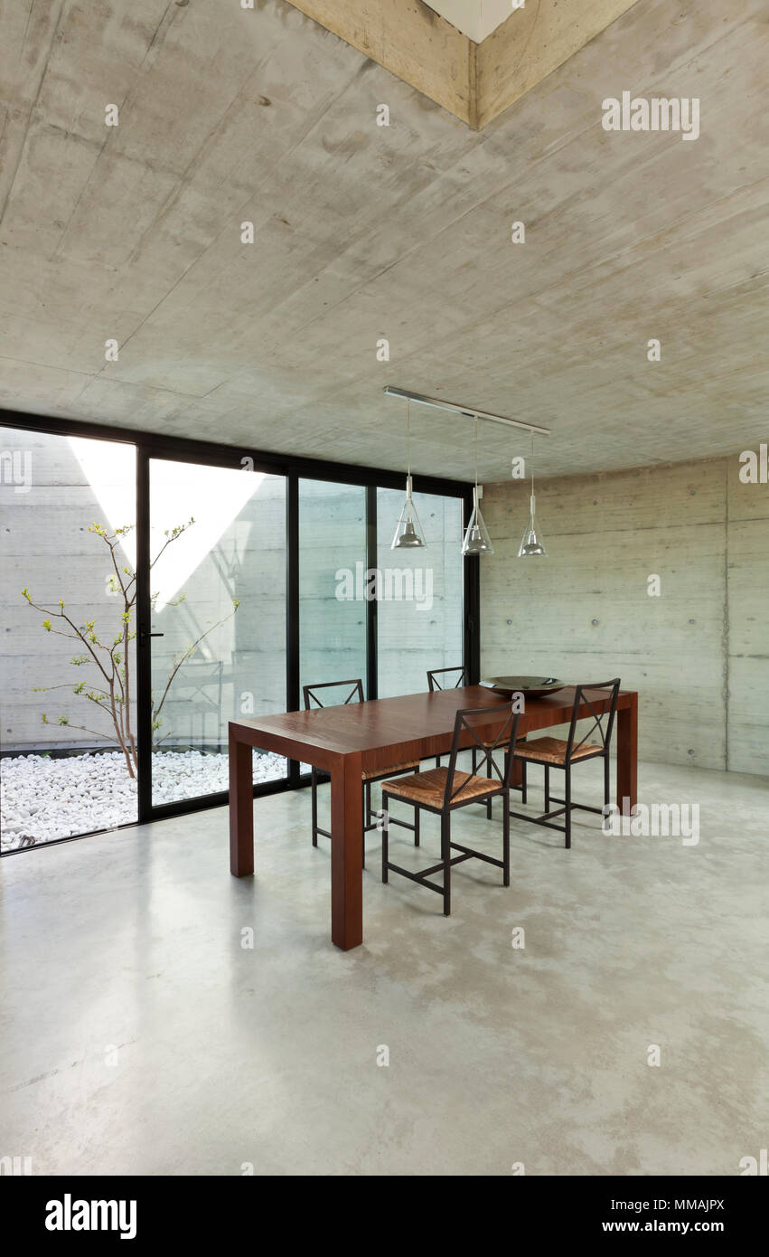 beautiful modern house in cement, interior, wooden dining table Stock ...