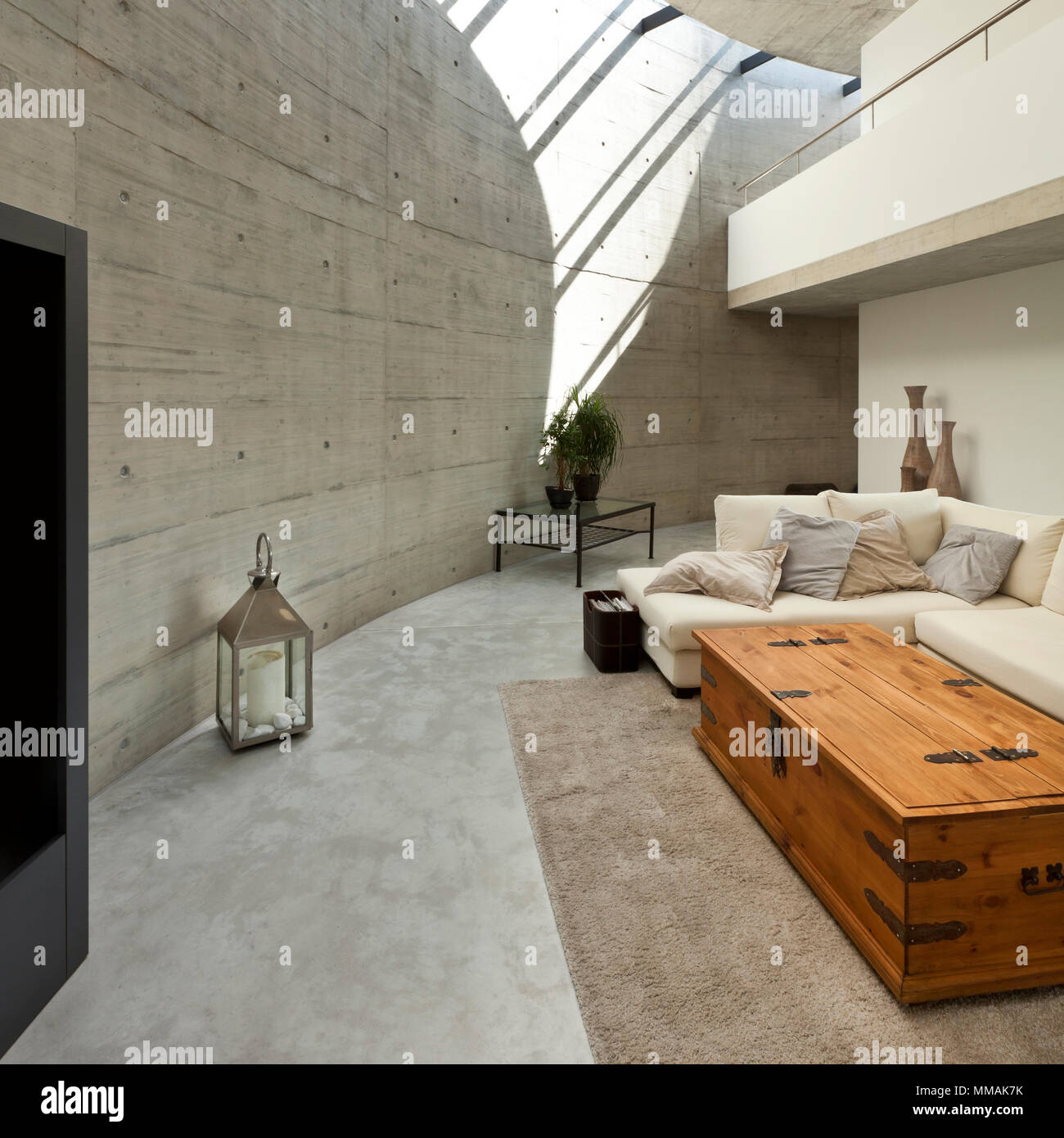 beautiful modern house in cement, interior, living room Stock Photo - Alamy