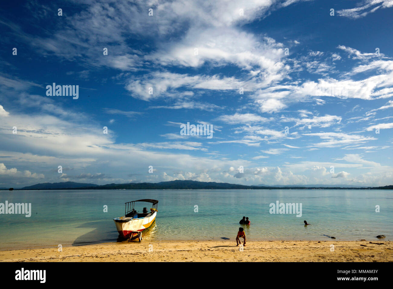 Visitors playing at Bokori Island, Kendari, South East Sulawesi ...