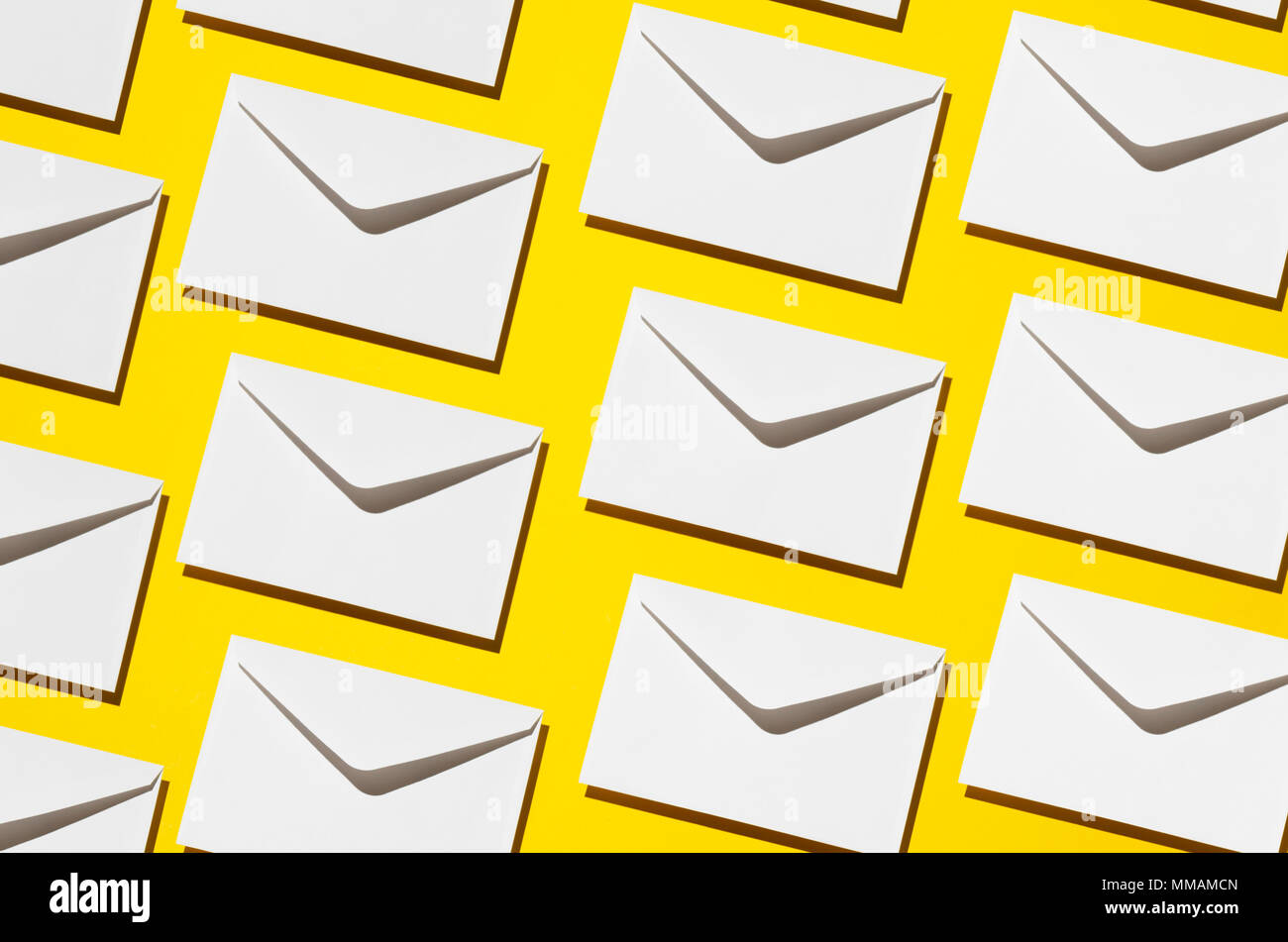 Envelopes pattern over yellow background, above view Stock Photo - Alamy