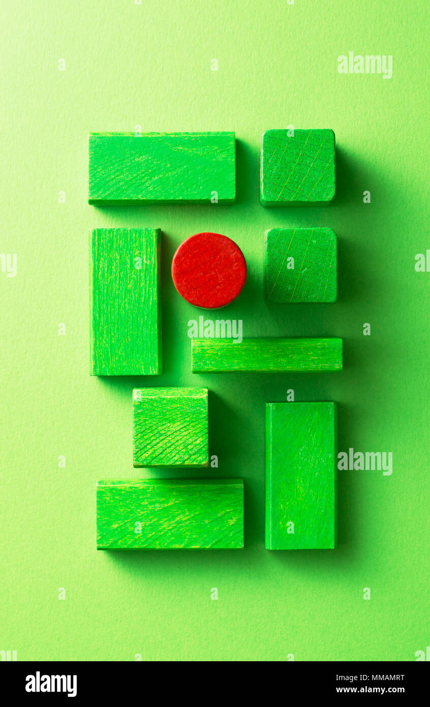 Green and red wooden cubes over green background, top view Stock Photo ...