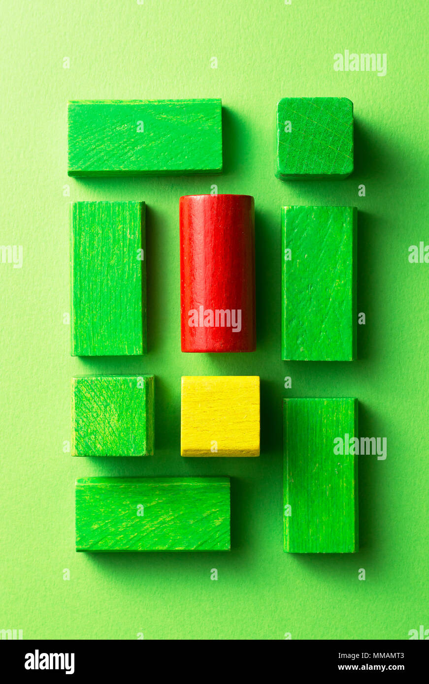 Green and red wooden cubes over green background, top view Stock Photo ...