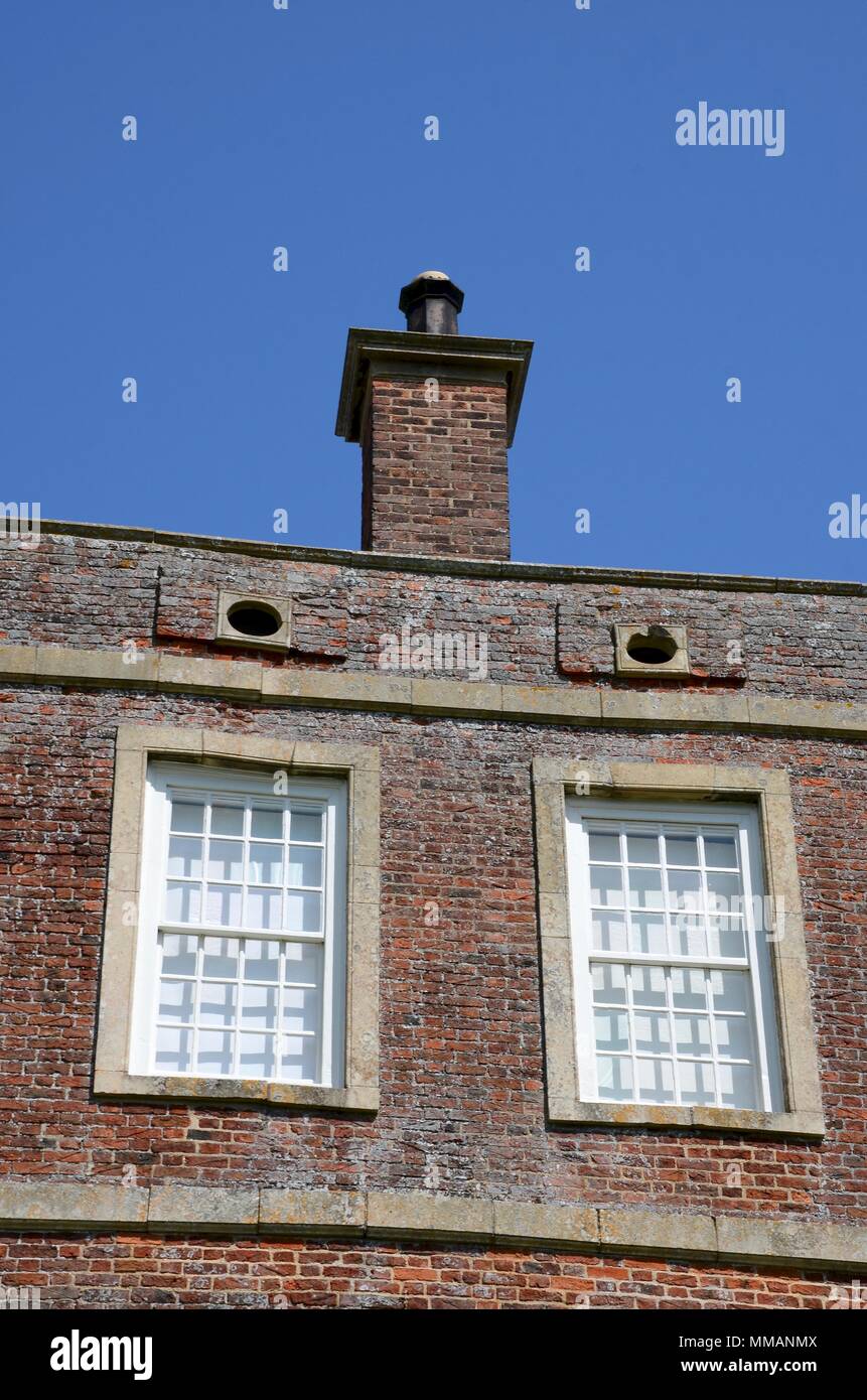 Windows and Barn Owl nest entry access holes on west wall of Gunby Hall ...