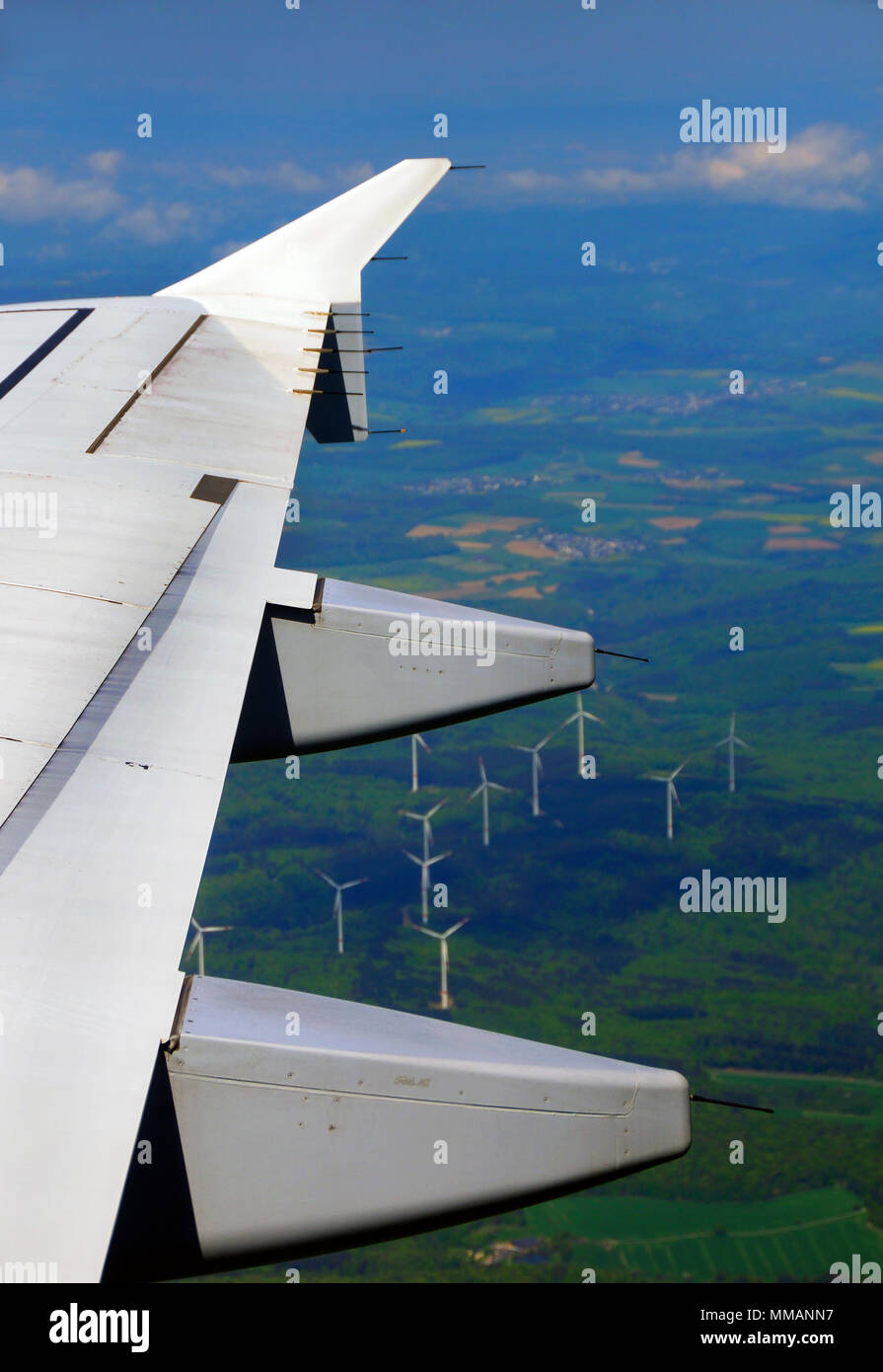 Aircraft Wing and wind farm Stock Photo - Alamy