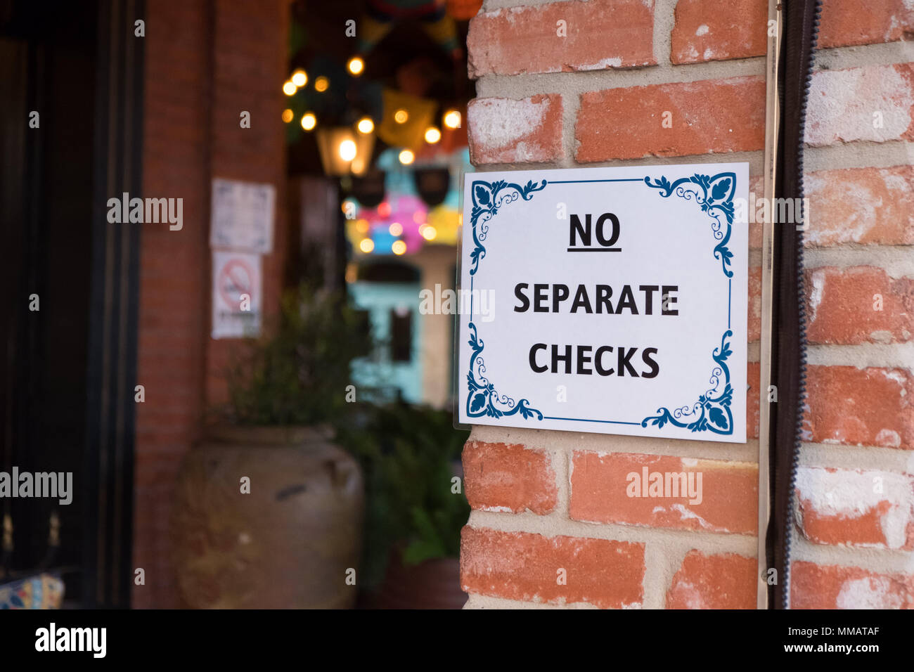 No Separate Checks Sign at Restaurant Stock Photo - Alamy