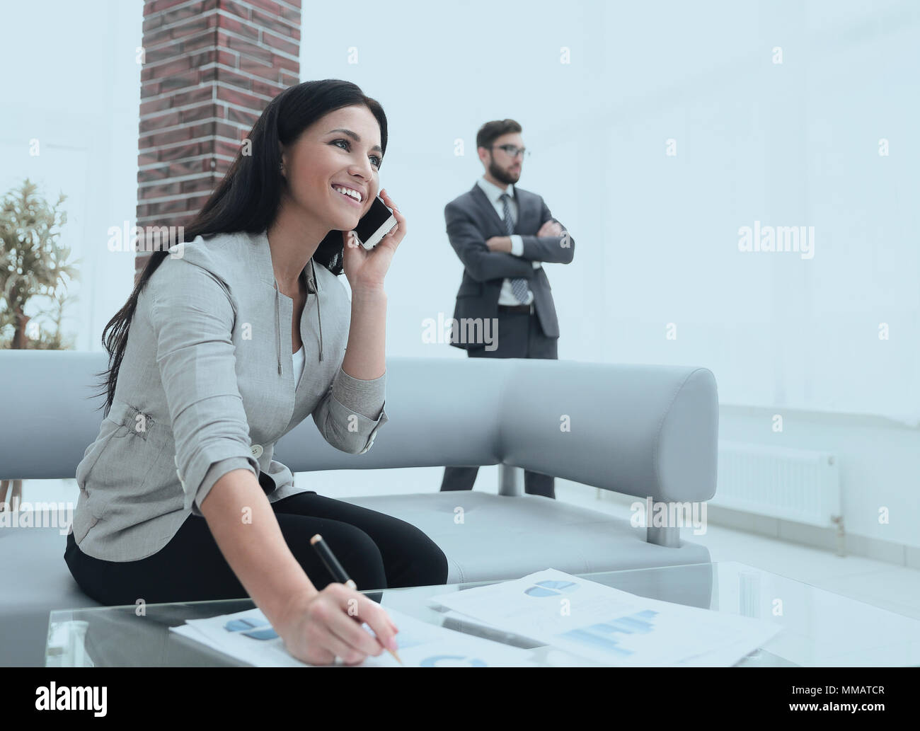 Woman assistant at the workplace in the office Stock Photo - Alamy