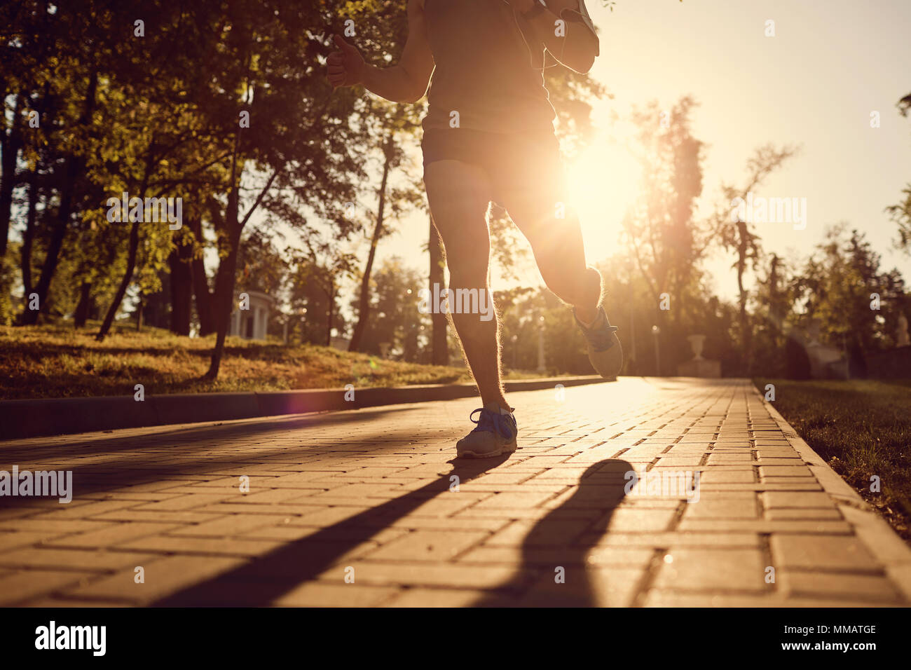 Runner running in park hi-res stock photography and images - Alamy