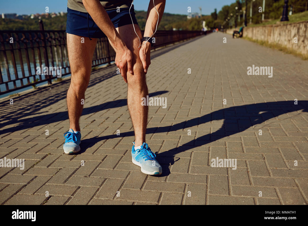 Injury, stretching, bruise on a run in a runner Stock Photo - Alamy
