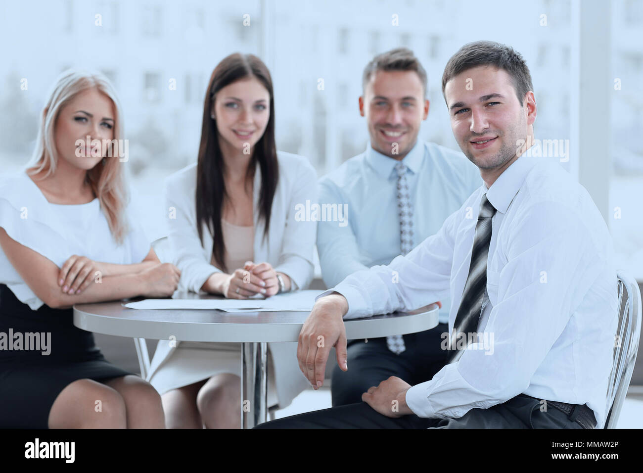 Business team sits table hi-res stock photography and images - Alamy
