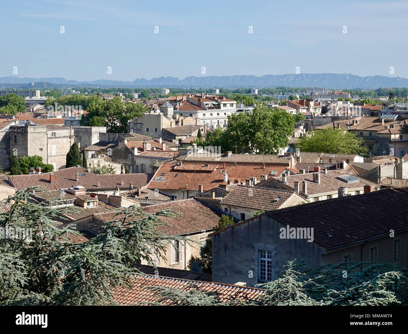 Looking over the rooftops of the old city with mountains in the ...