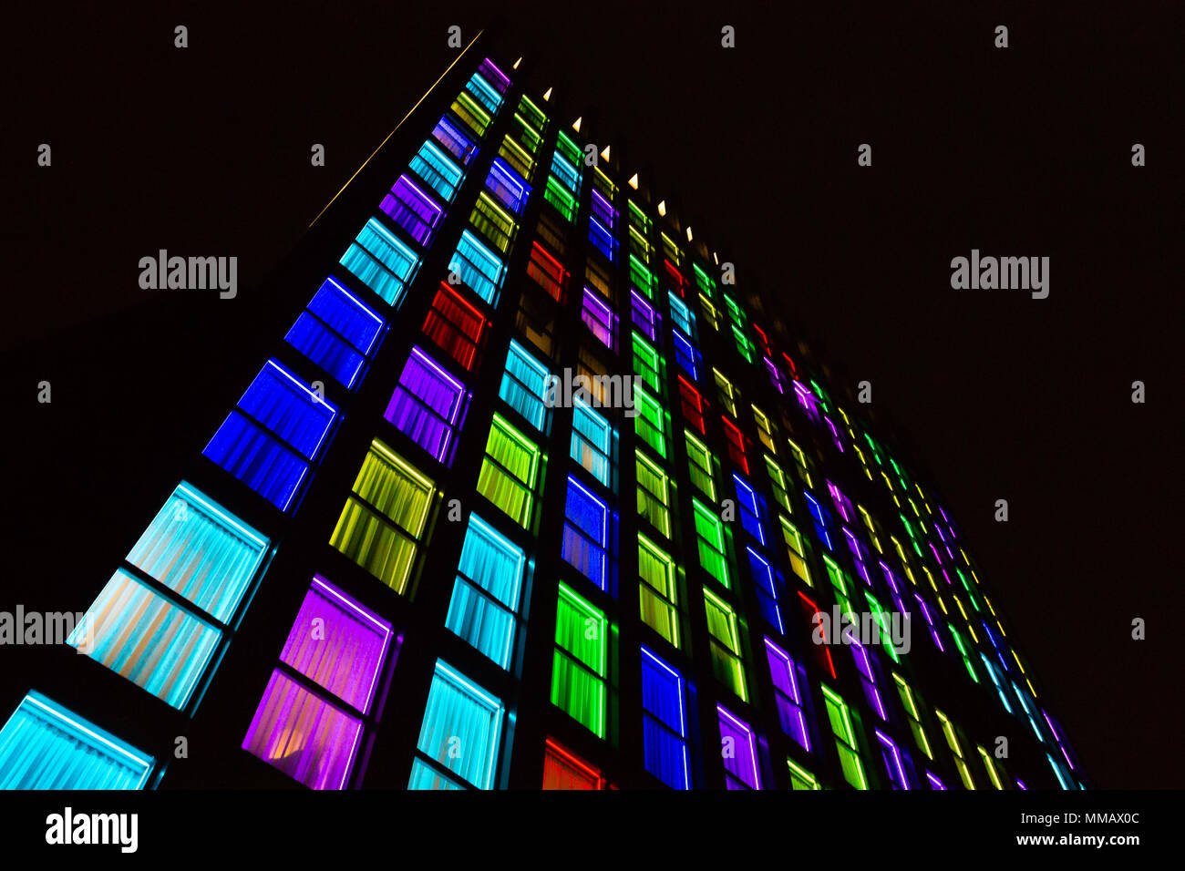 Colored windows texture. Windows illuminated by neon lights background ...