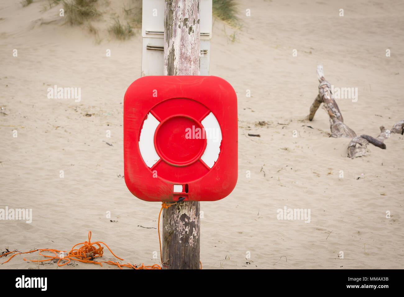 Life ring or life buoy at the entrance to Harlech beach in North Wales ...