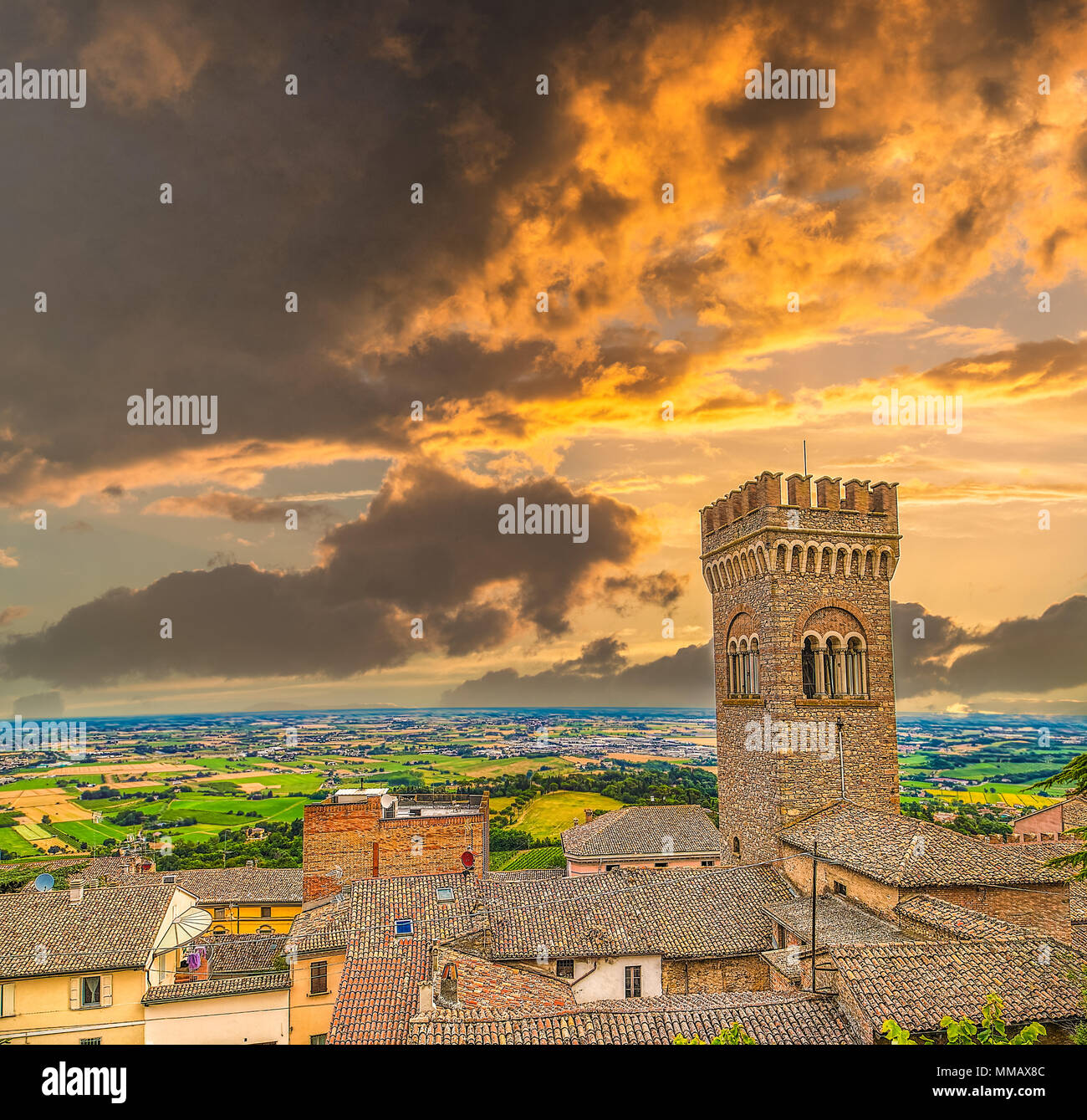 view of tower in medieval village overlooking Italian countryside Stock ...