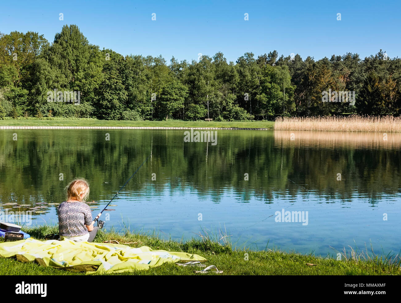 A young girl fishing Stock Photo - Alamy