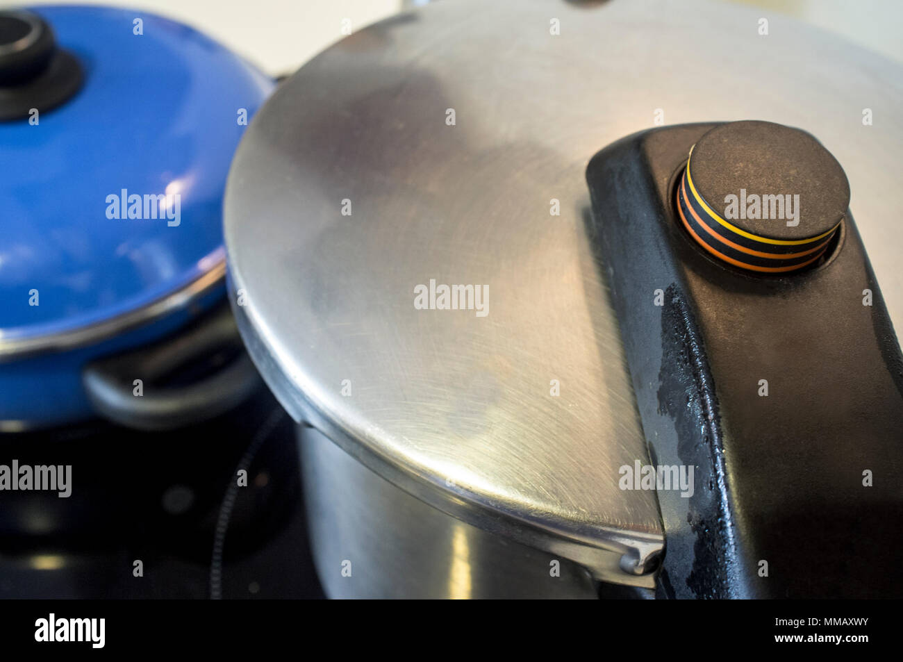 Stainless Steel Pressure Cooker at work. Rising indicator detail with ...