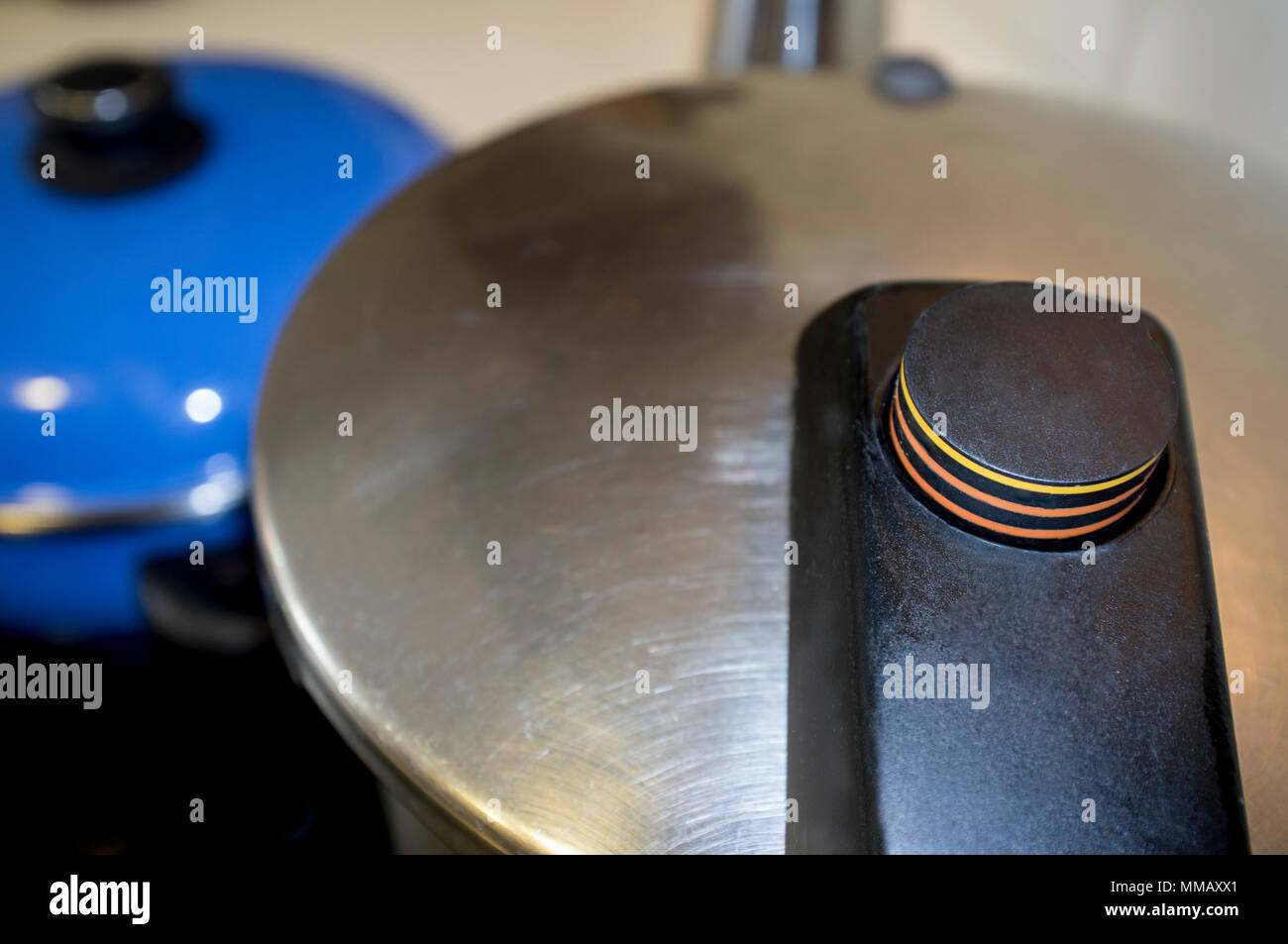 Stainless Steel Pressure Cooker at work. Rising indicator detail with ...